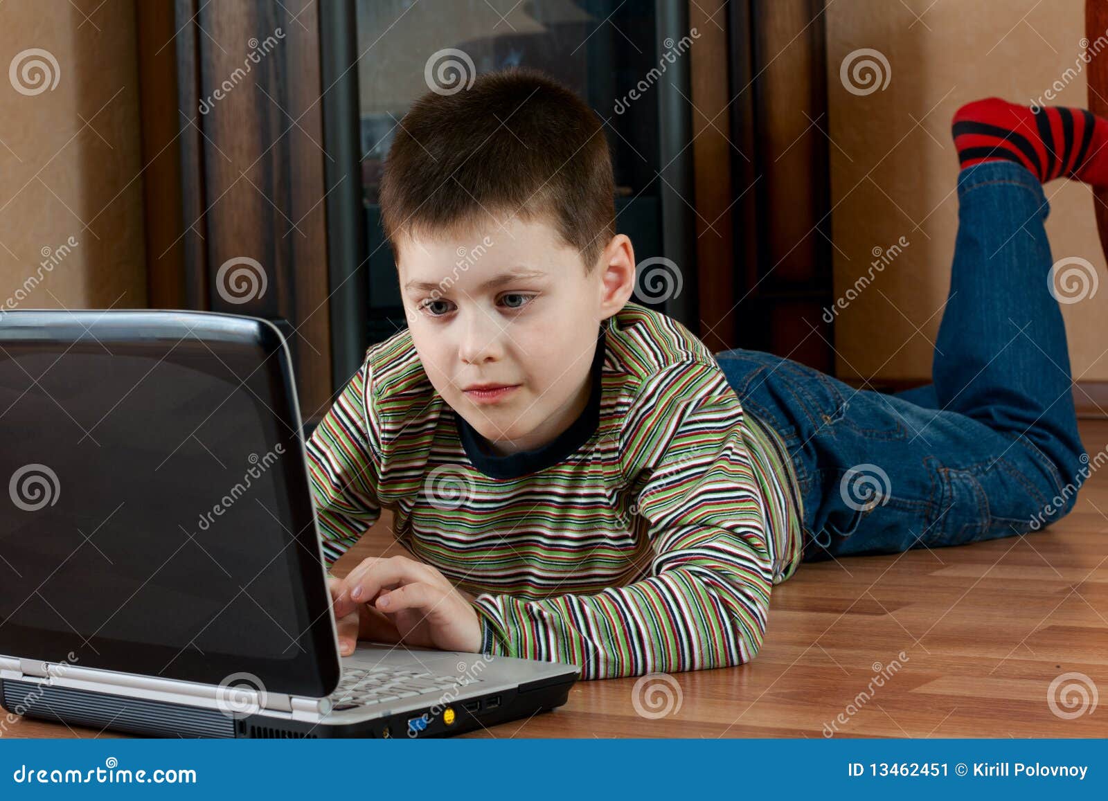 Boy playing computer game stock image. Image of body - 13462451