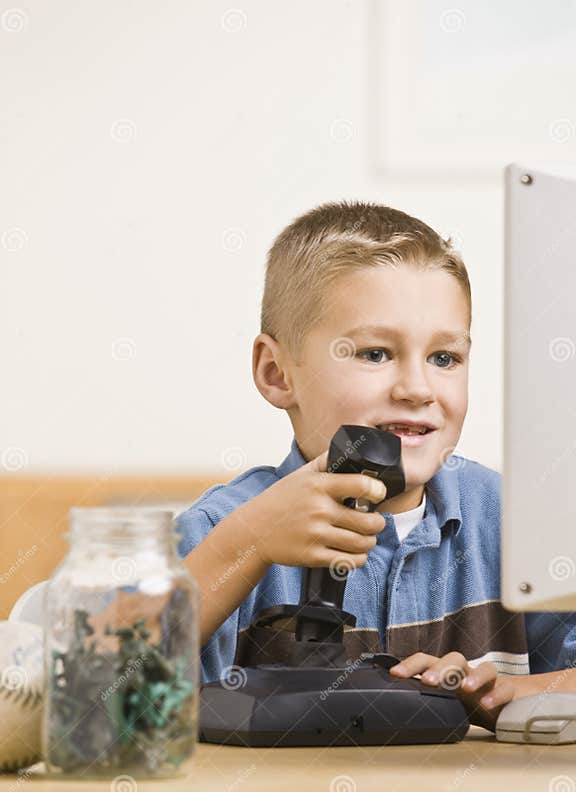 Boy Playing Computer Games stock image. Image of arcade - 10196399