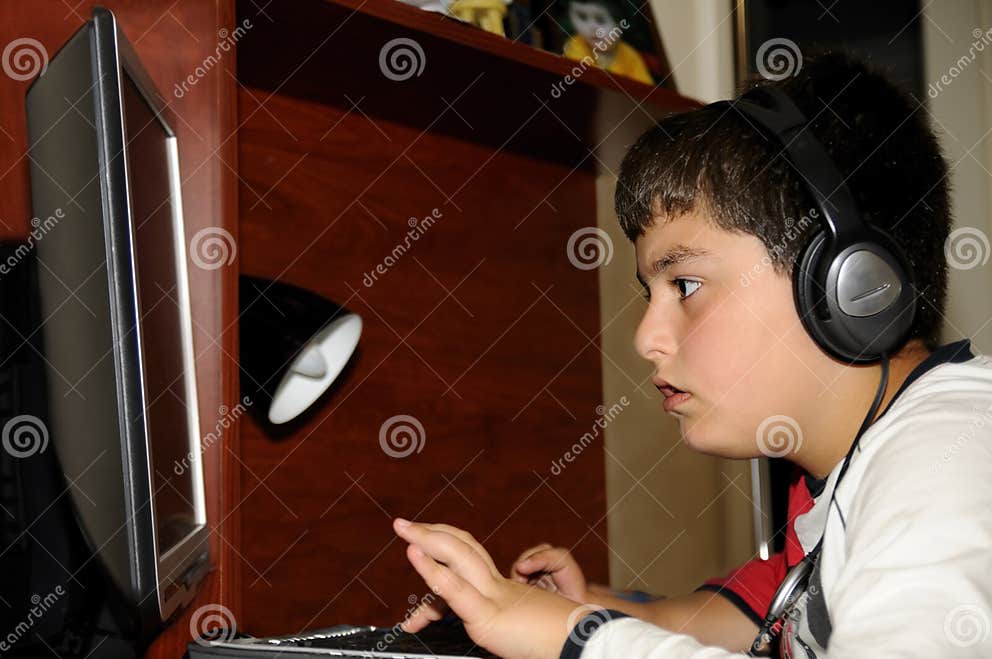 Boy playing computer games stock photo. Image of concentrate - 18087016