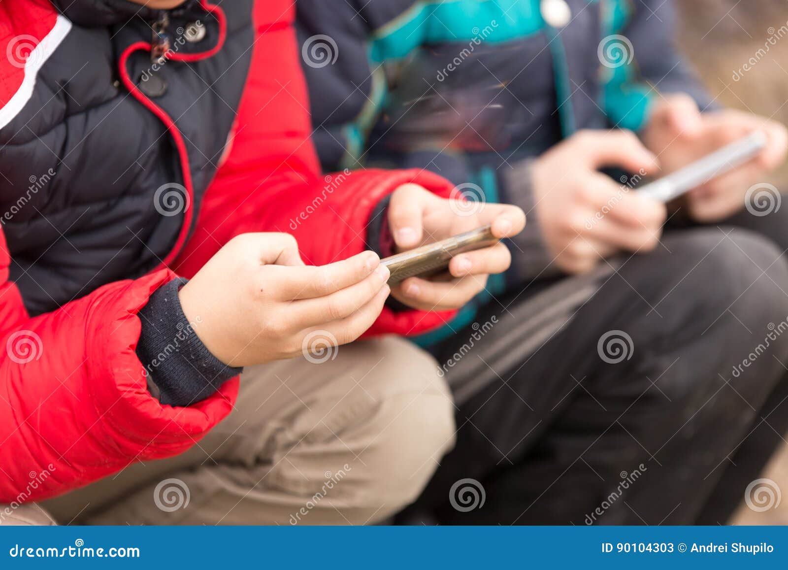 Boy Playing Computer Games on a Cell Phone Stock Image - Image of ...