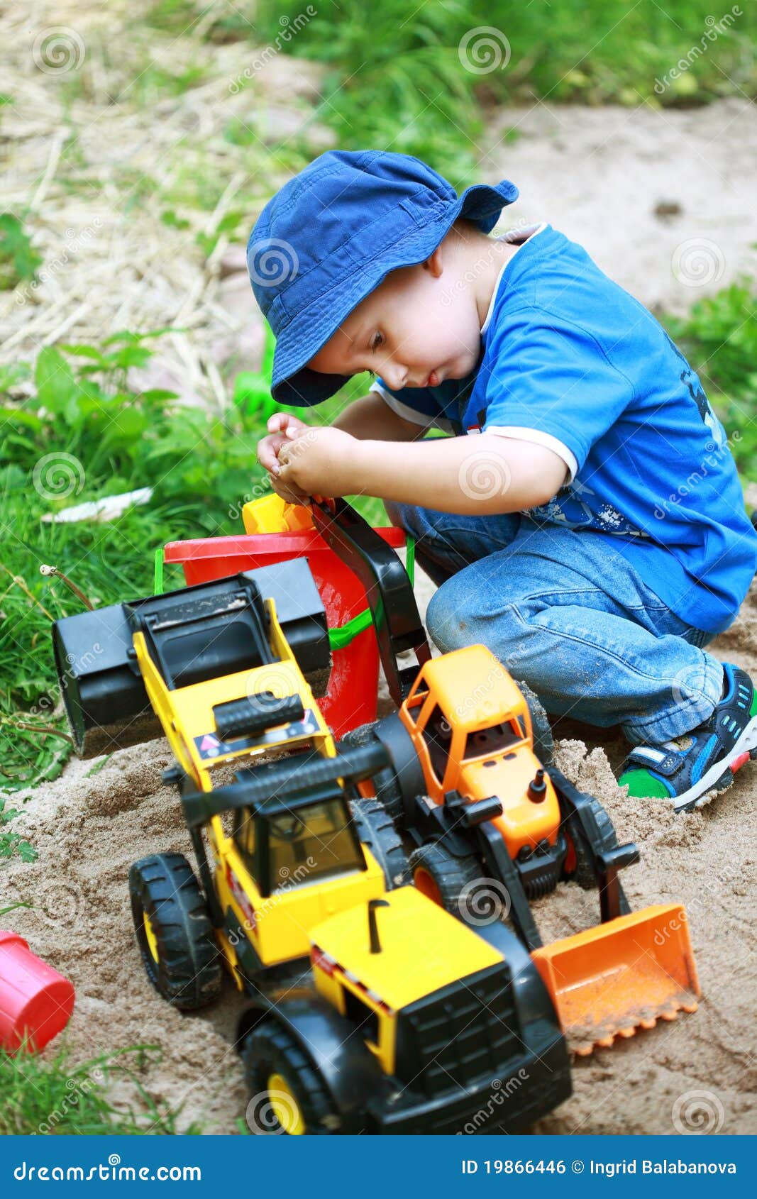 Boy playing with digger stock photo. Image of build, grass - 19866446