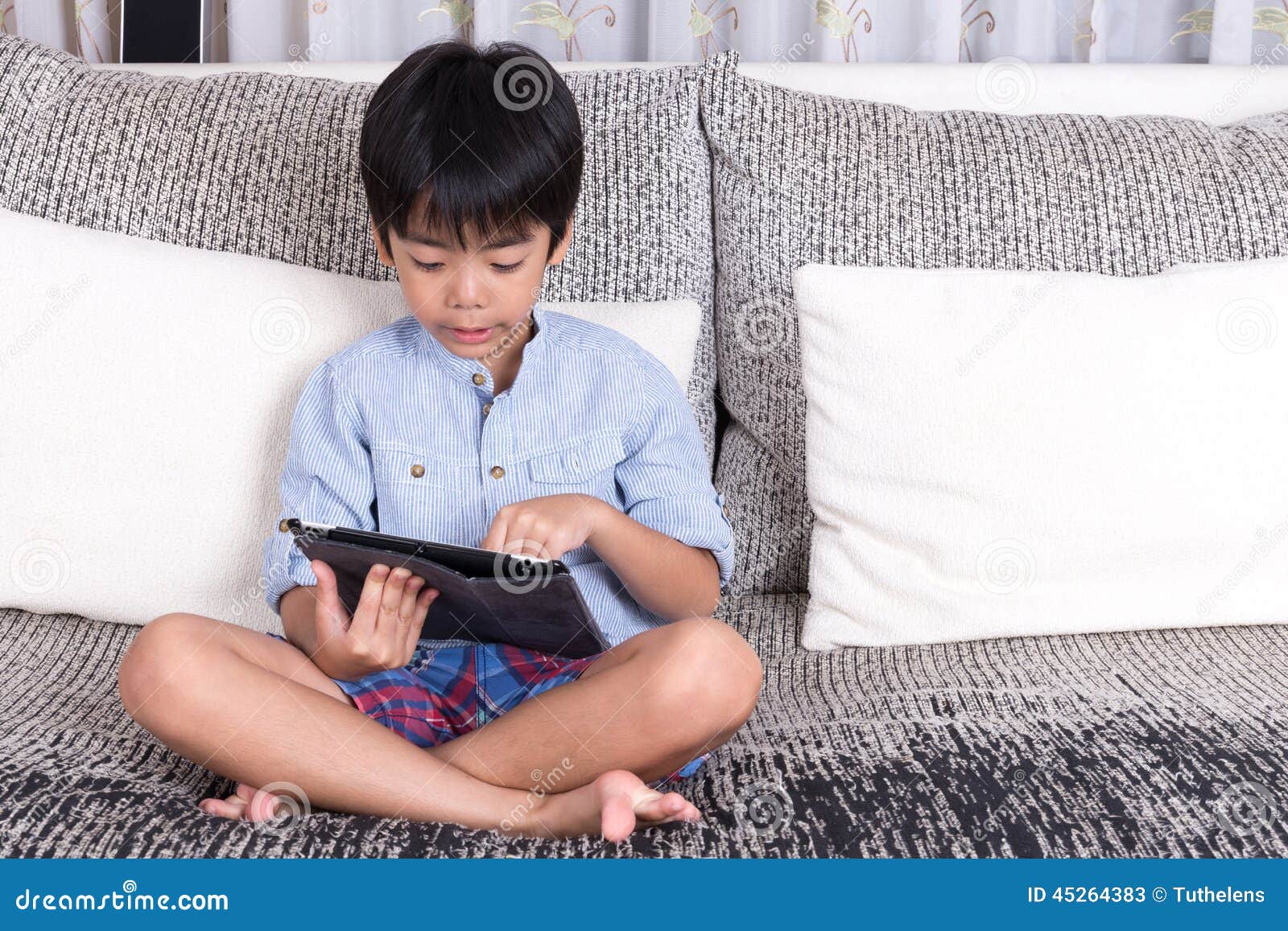 Boy playing digital tablet stock image. Image of enjoying - 45264383