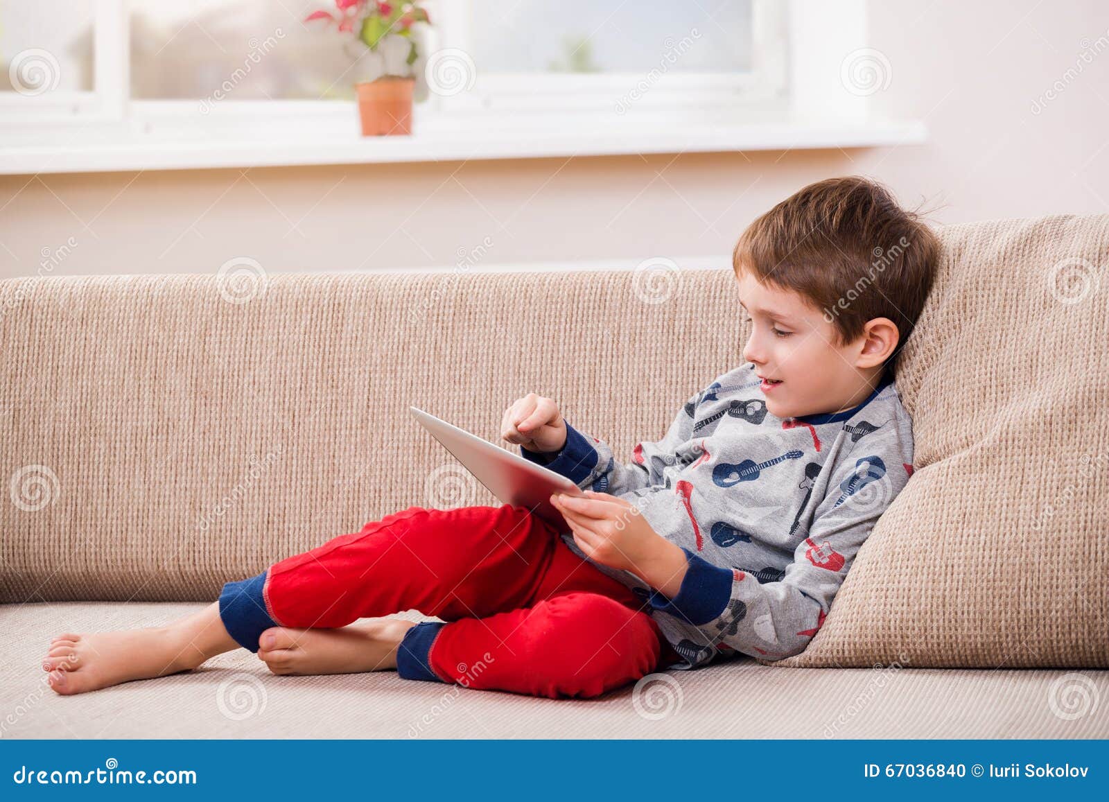 Boy Playing with Digital Tablet Stock Photo - Image of looking, indoors ...