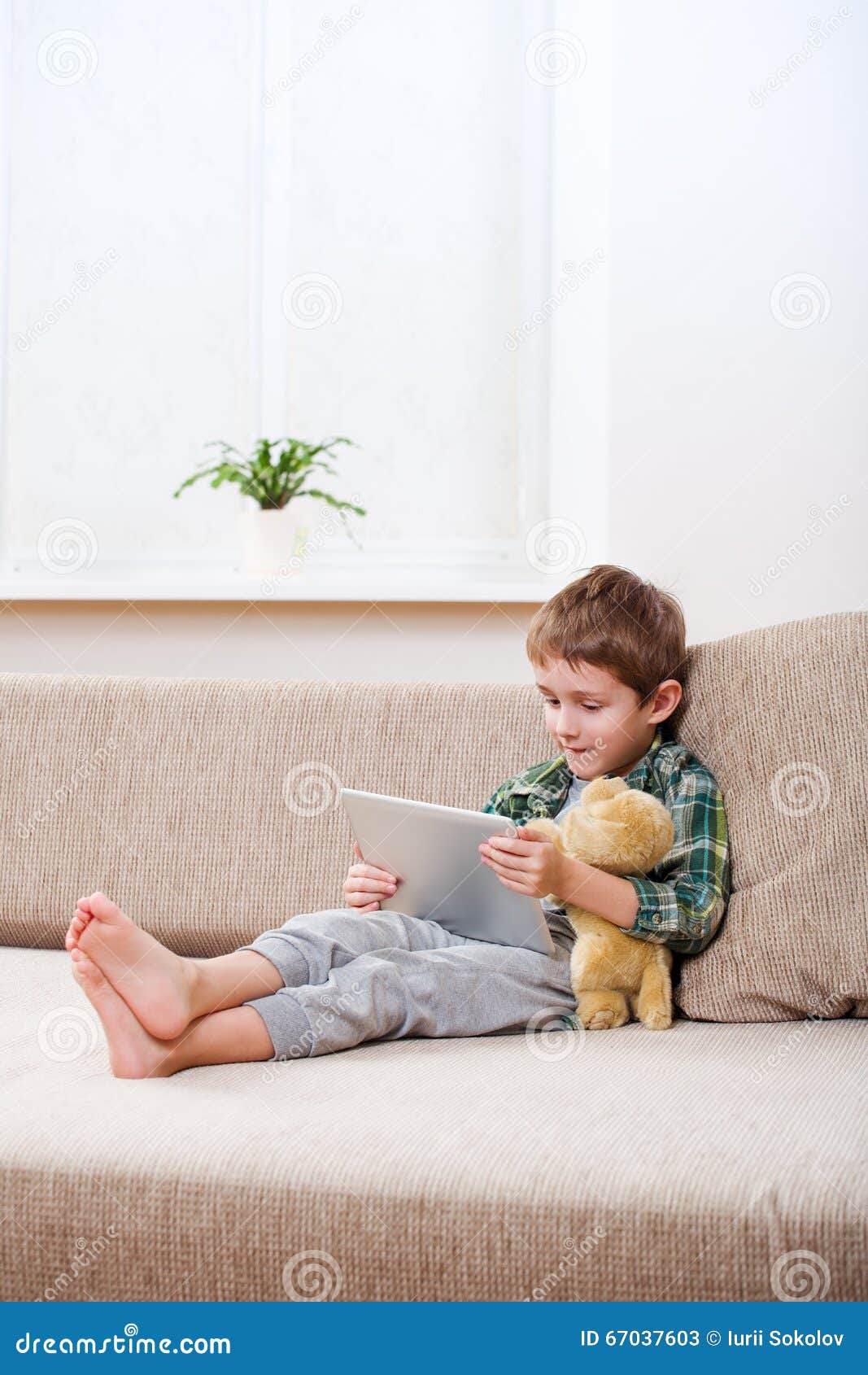 Boy Playing with Digital Tablet Stock Image - Image of alone, looking ...