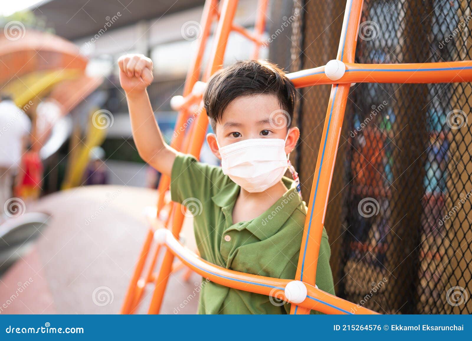 A Boy is Playing with Face Masks on Playground during Quarantine Covid ...