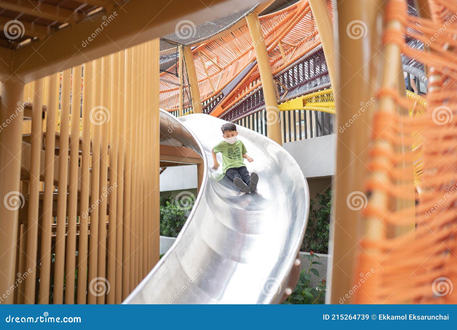 A Boy is Playing with Face Masks on Playground during Quarantine Covid ...