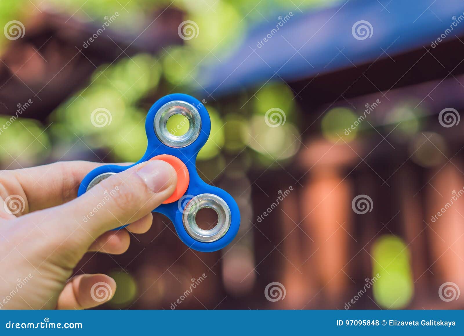 Boy Playing with Fidget Spinner. Child Spinning Spinner on the ...