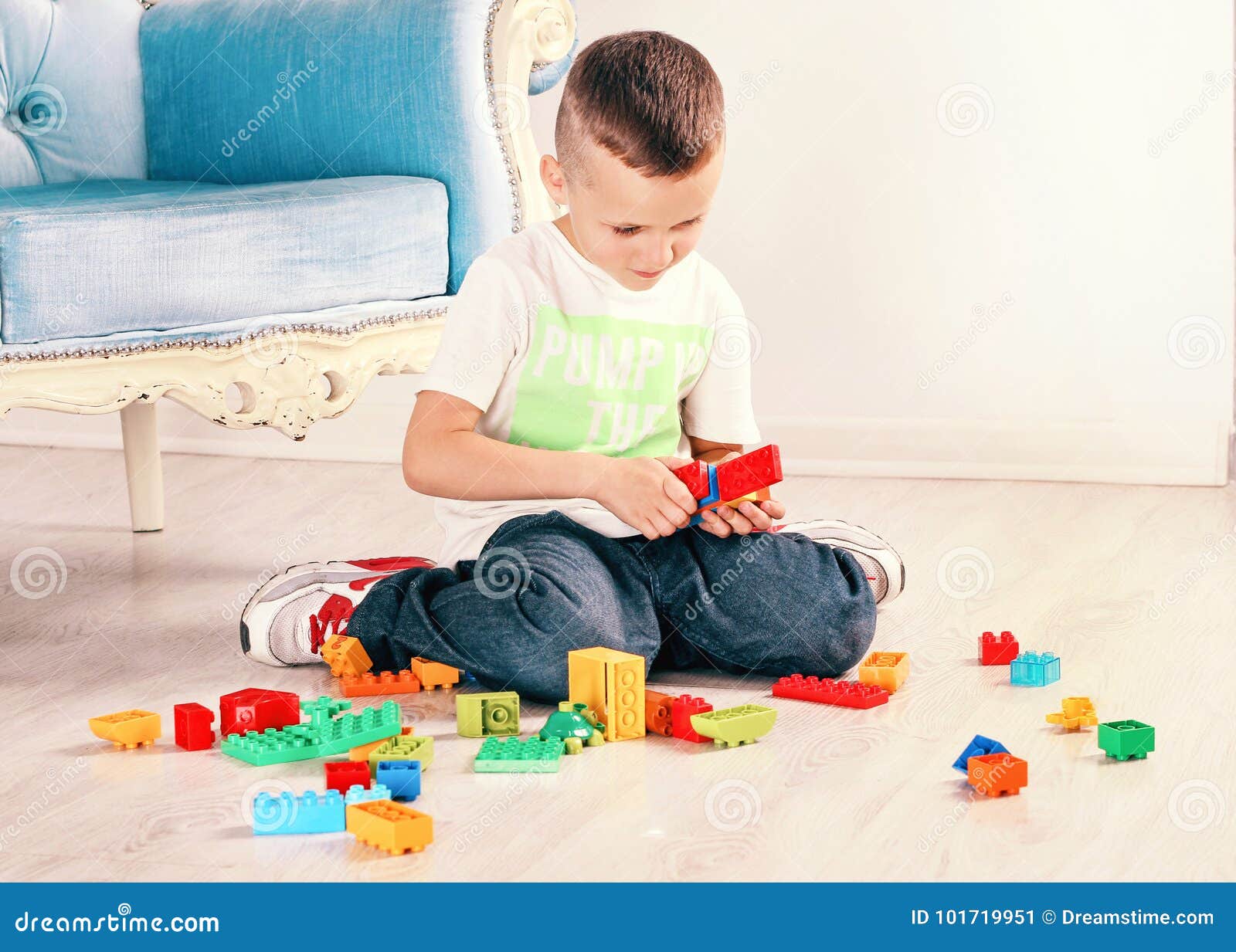 Boy playing on the floor stock image. Image of isolated - 101719951