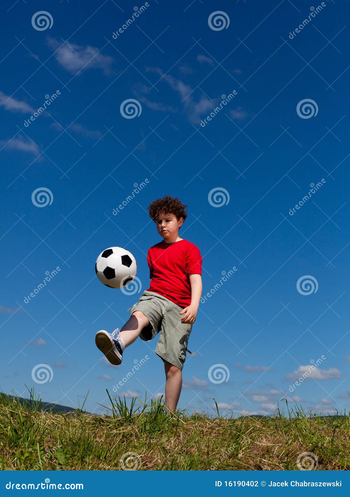 Boy playing football stock photo. Image of competition - 16190402