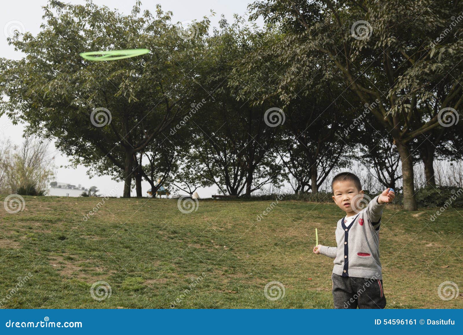 Boy playing frisbee stock image. Image of chinese, lifestyle - 54596161