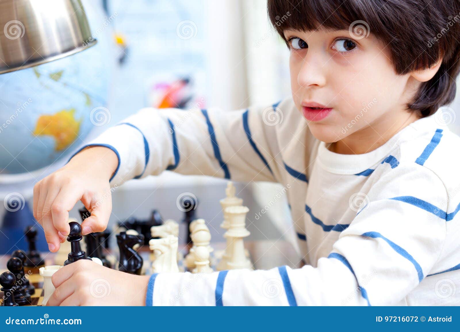 Boy Playing a Game of Chess Stock Photo - Image of person, child: 97216072