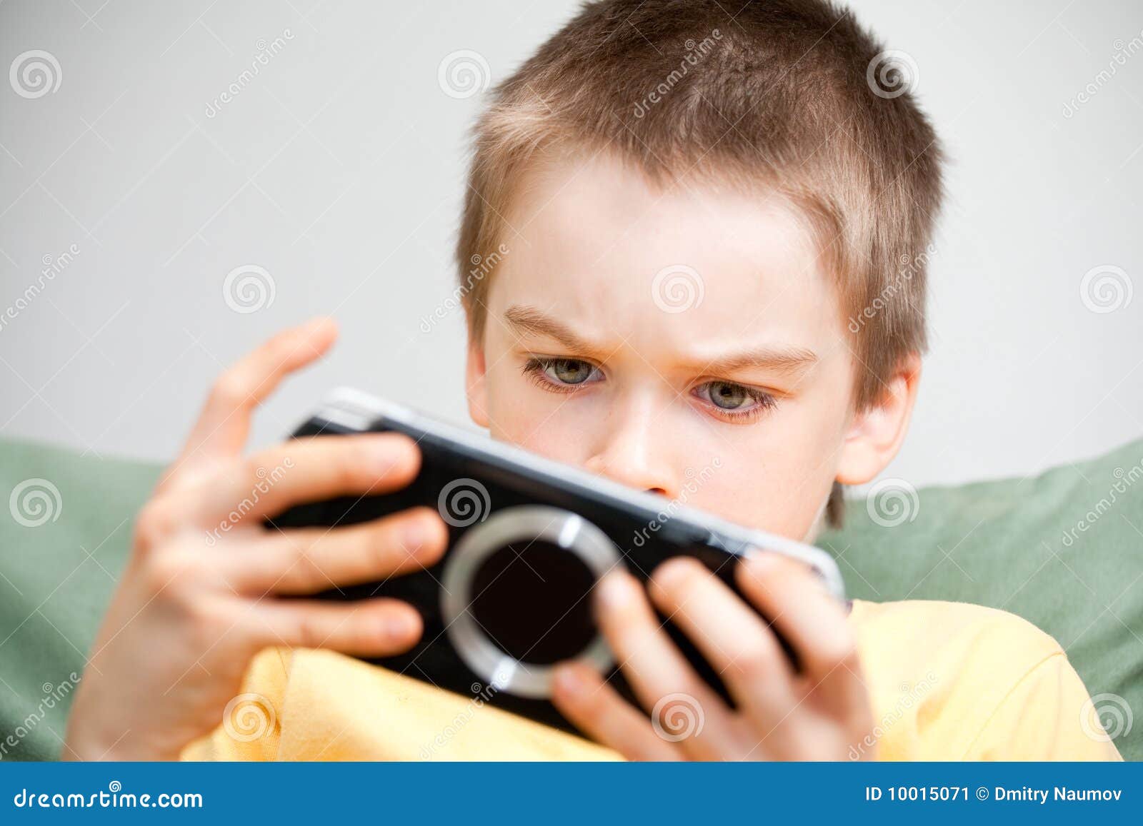 Boy playing game console stock image. Image of computer - 10015071