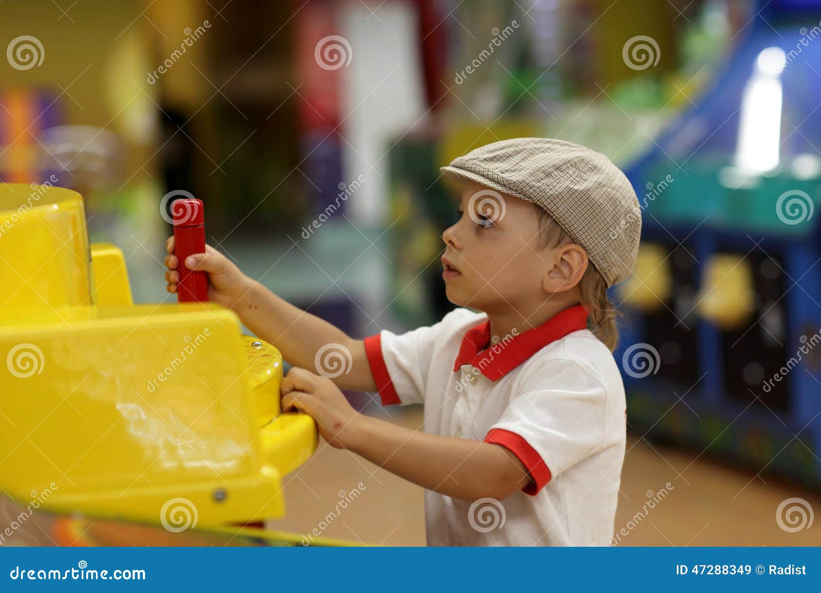 Boy Playing with Game Machine Stock Image - Image of machine ...