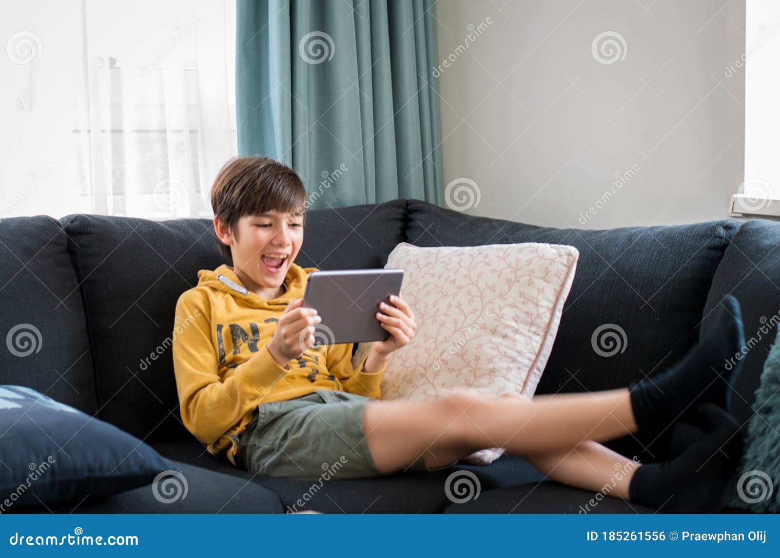 A Boy Show Emotional Face Expression Playing Game on Smartphone Stock ...