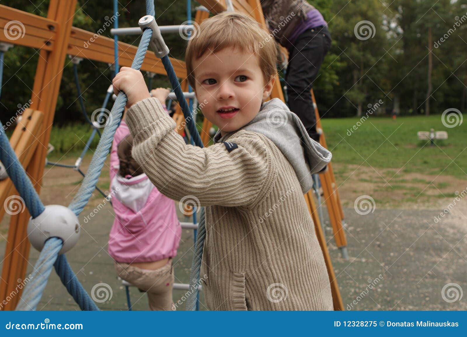 Boy in a playing ground stock image. Image of climb, outdoors - 12328275