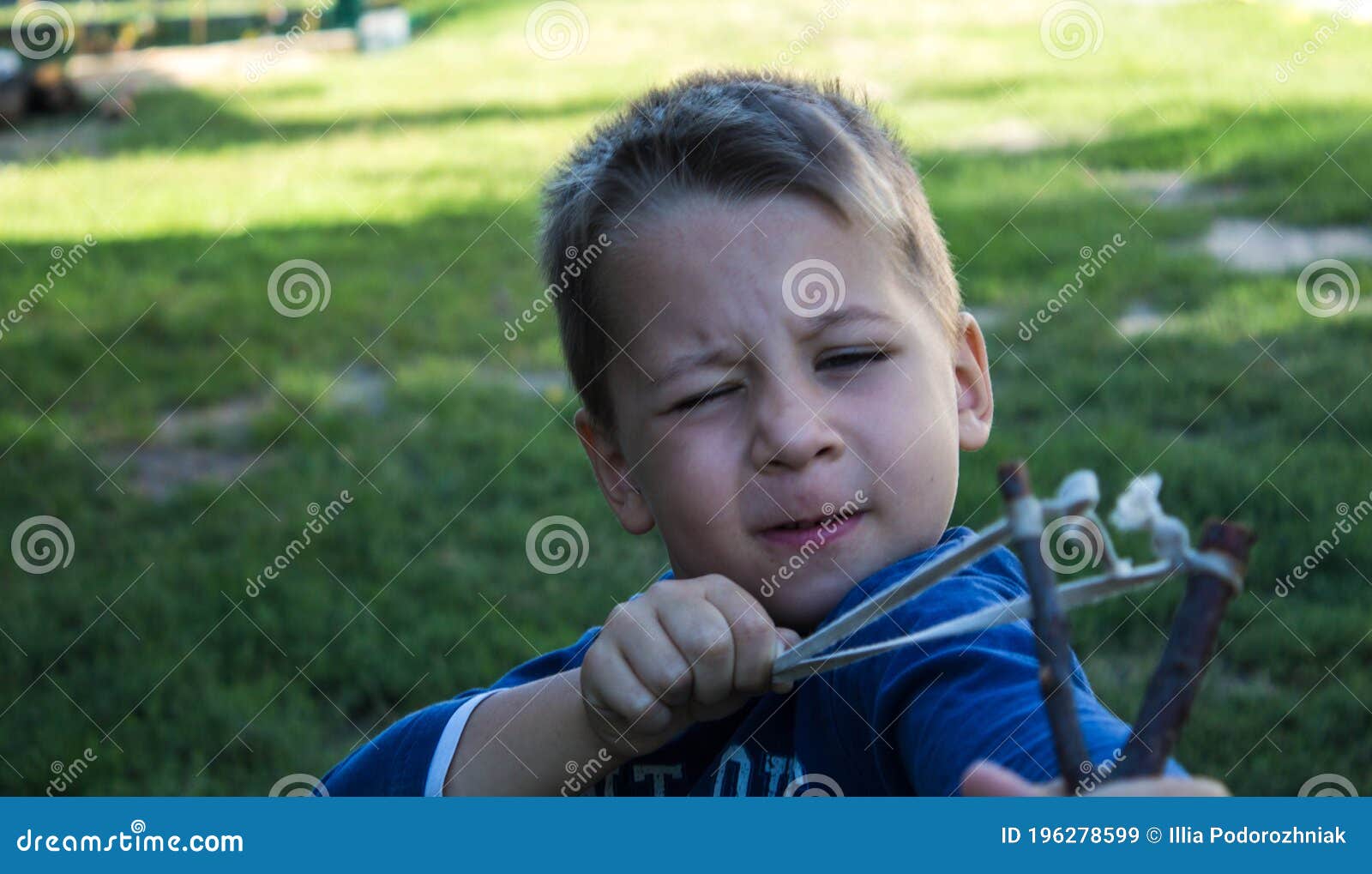 A Boy Playing with a Handmade Slingshot Stock Image - Image of ...