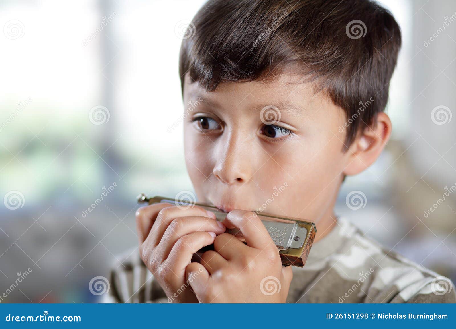 Boy playing harmonica stock photo. Image of play, happy - 26151298
