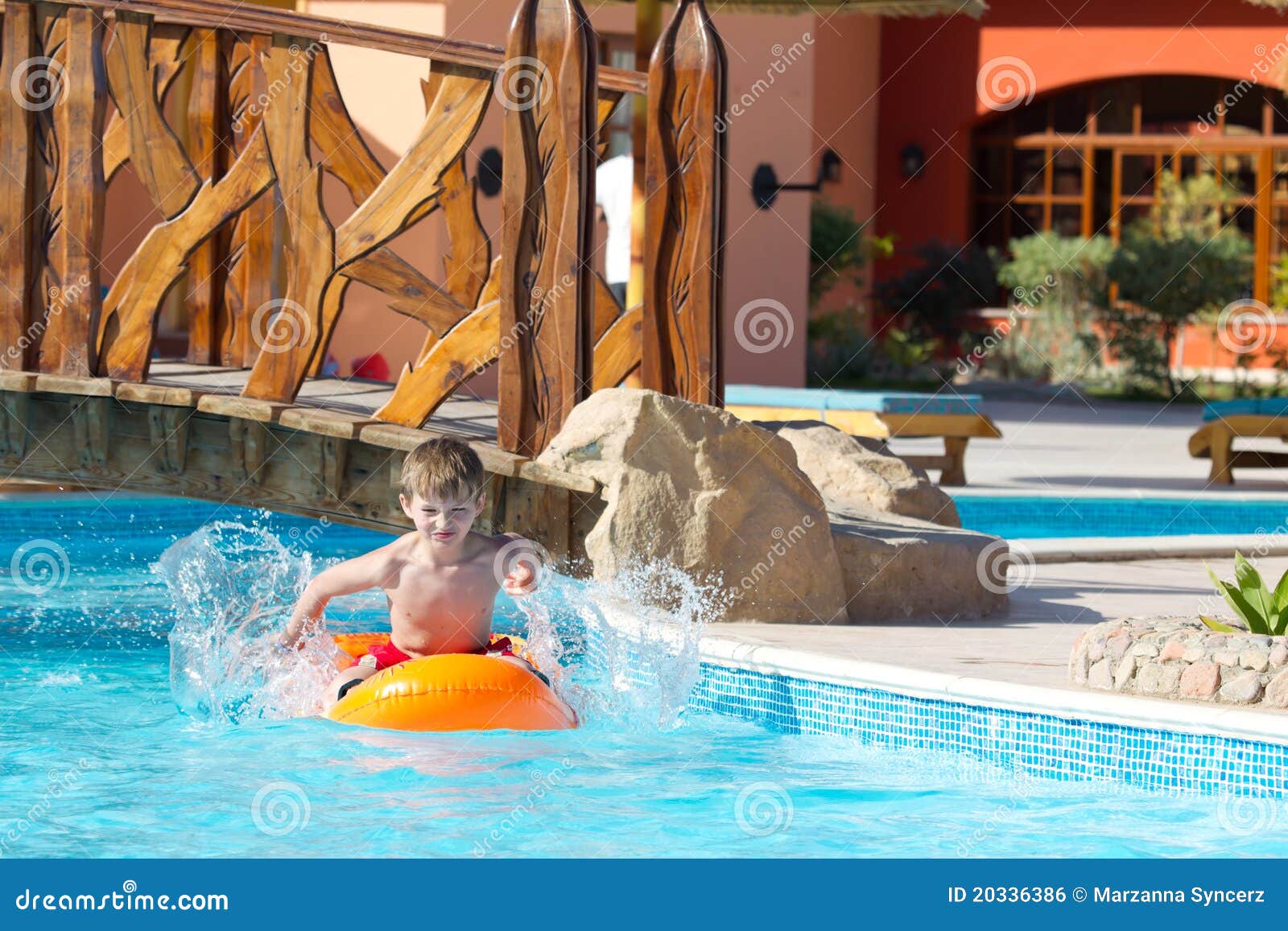 Boy playing in hotel pool stock photo. Image of outdoors - 20336386