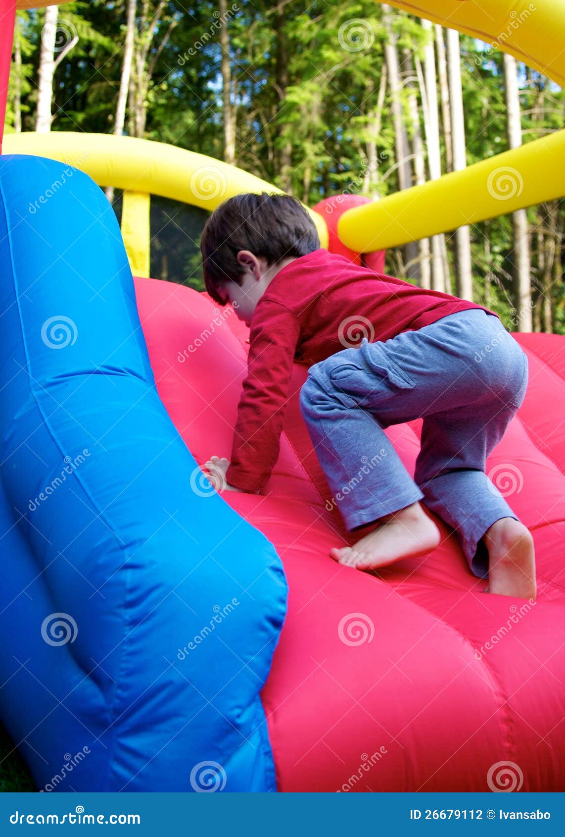 Boy Playing on Inflatable Castle Stock Photo - Image of outdoor ...