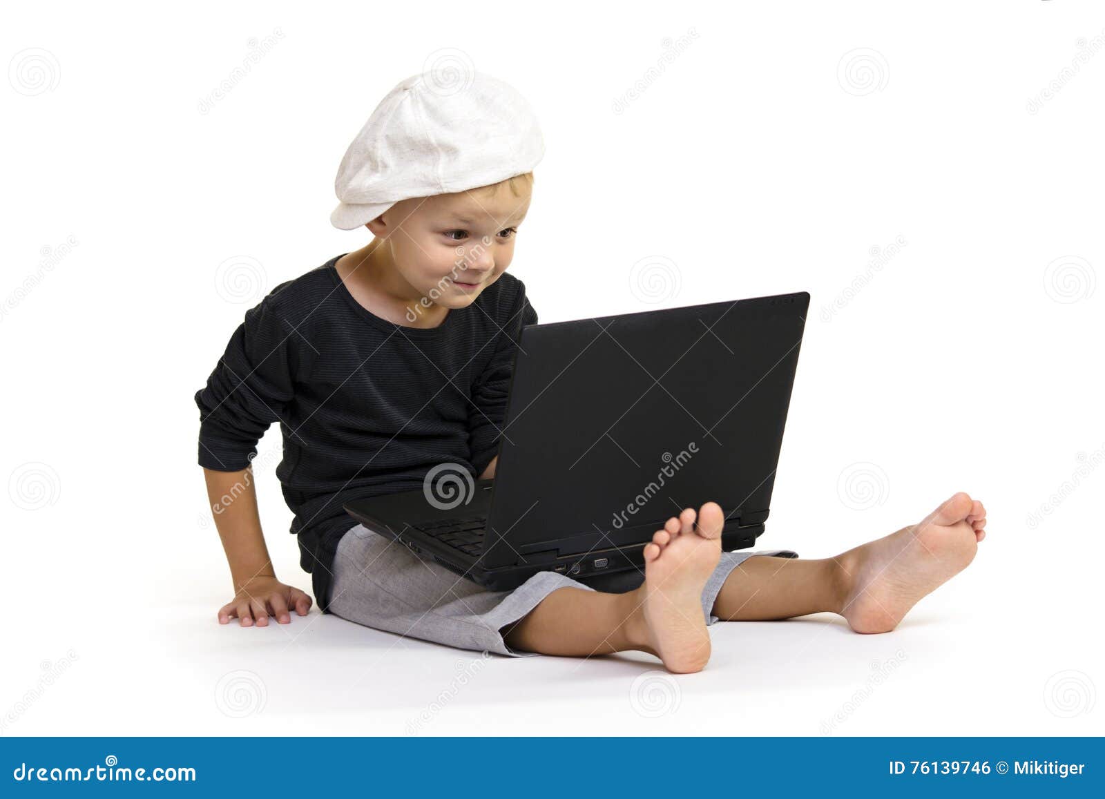 Boy playing laptop stock photo. Image of surprise, child - 76139746