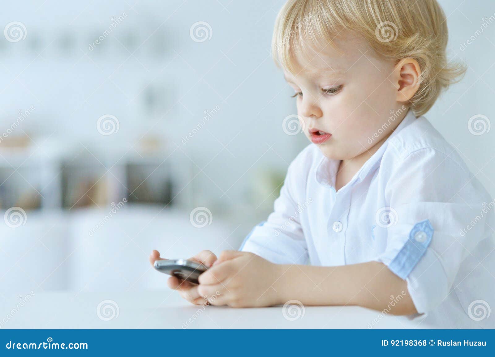 Boy is Playing with a Mobile Phone Stock Photo - Image of smartphone ...