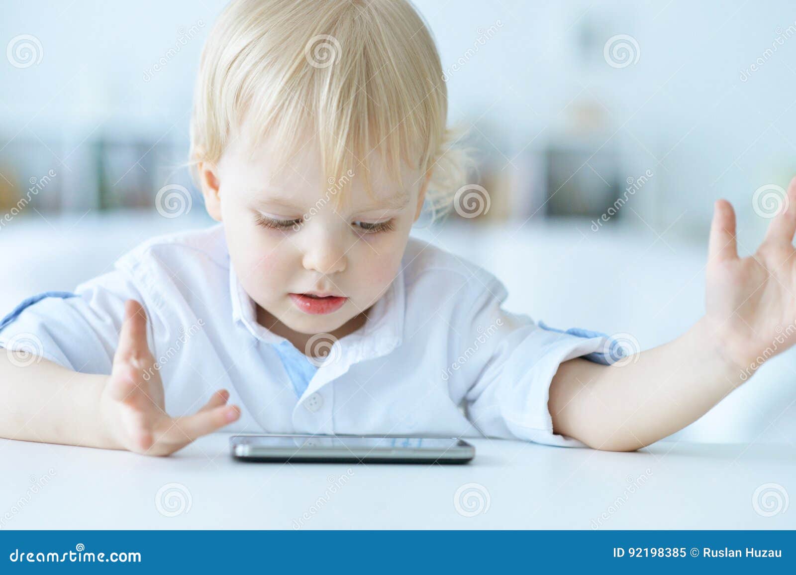 Boy is Playing with a Mobile Phone Stock Image - Image of home, gadget ...