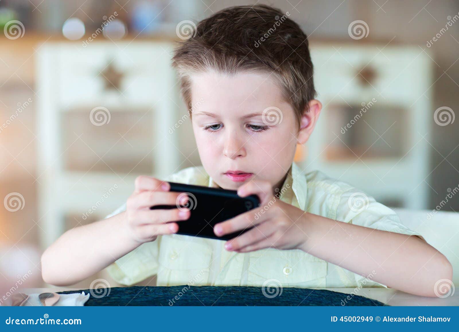 Boy Playing on Mobile Phone Stock Image - Image of childhood, phone ...