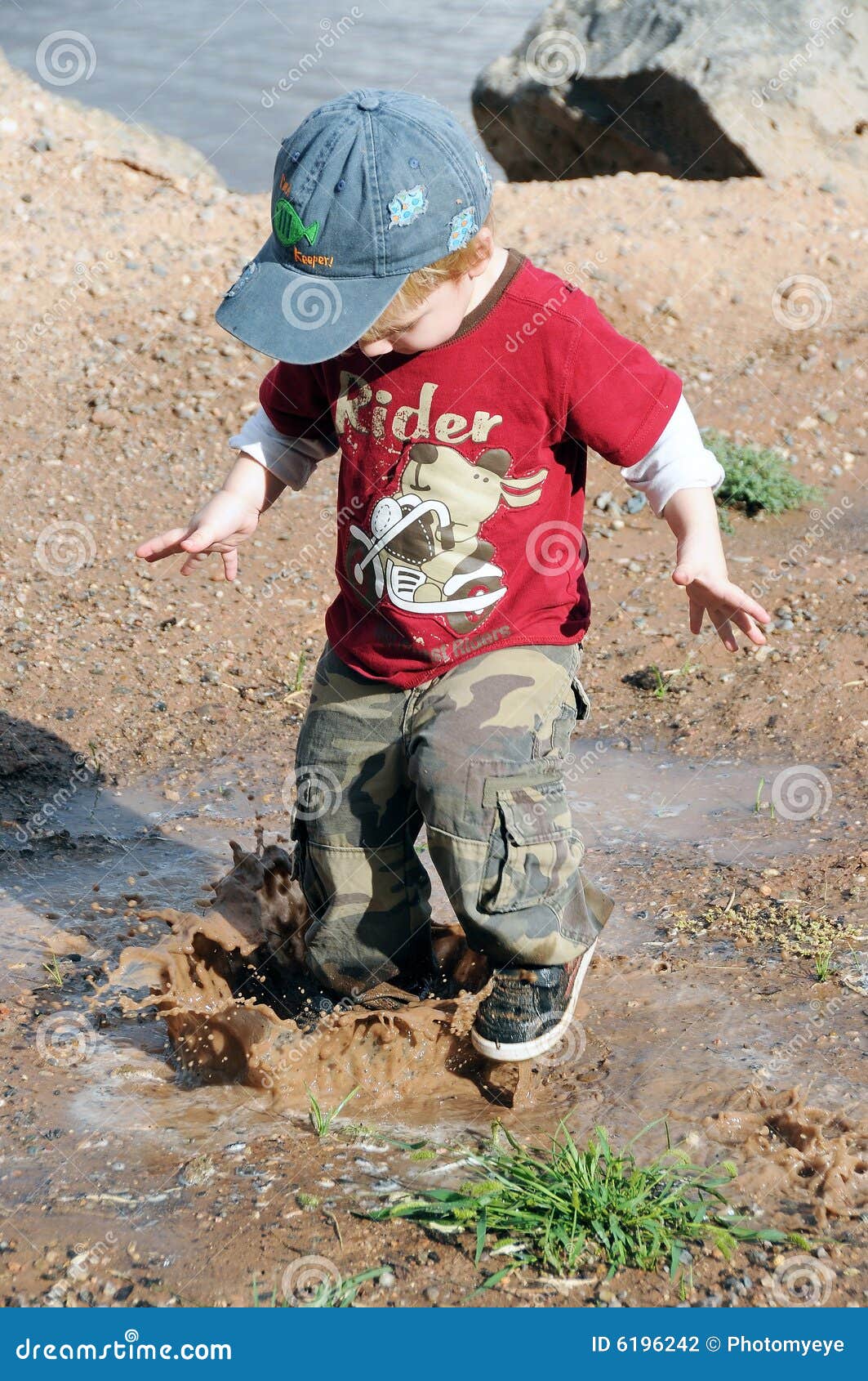 Boy Playing In Mud Puddle Stock Photography - Image: 6196242