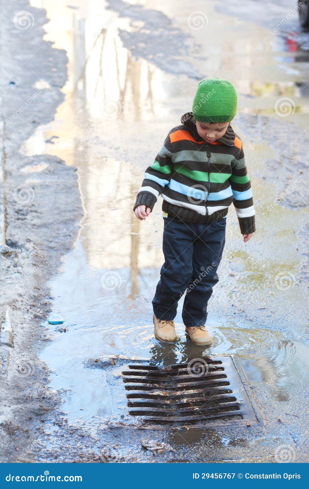 Boy playing near drainage stock image. Image of drainage - 29456767