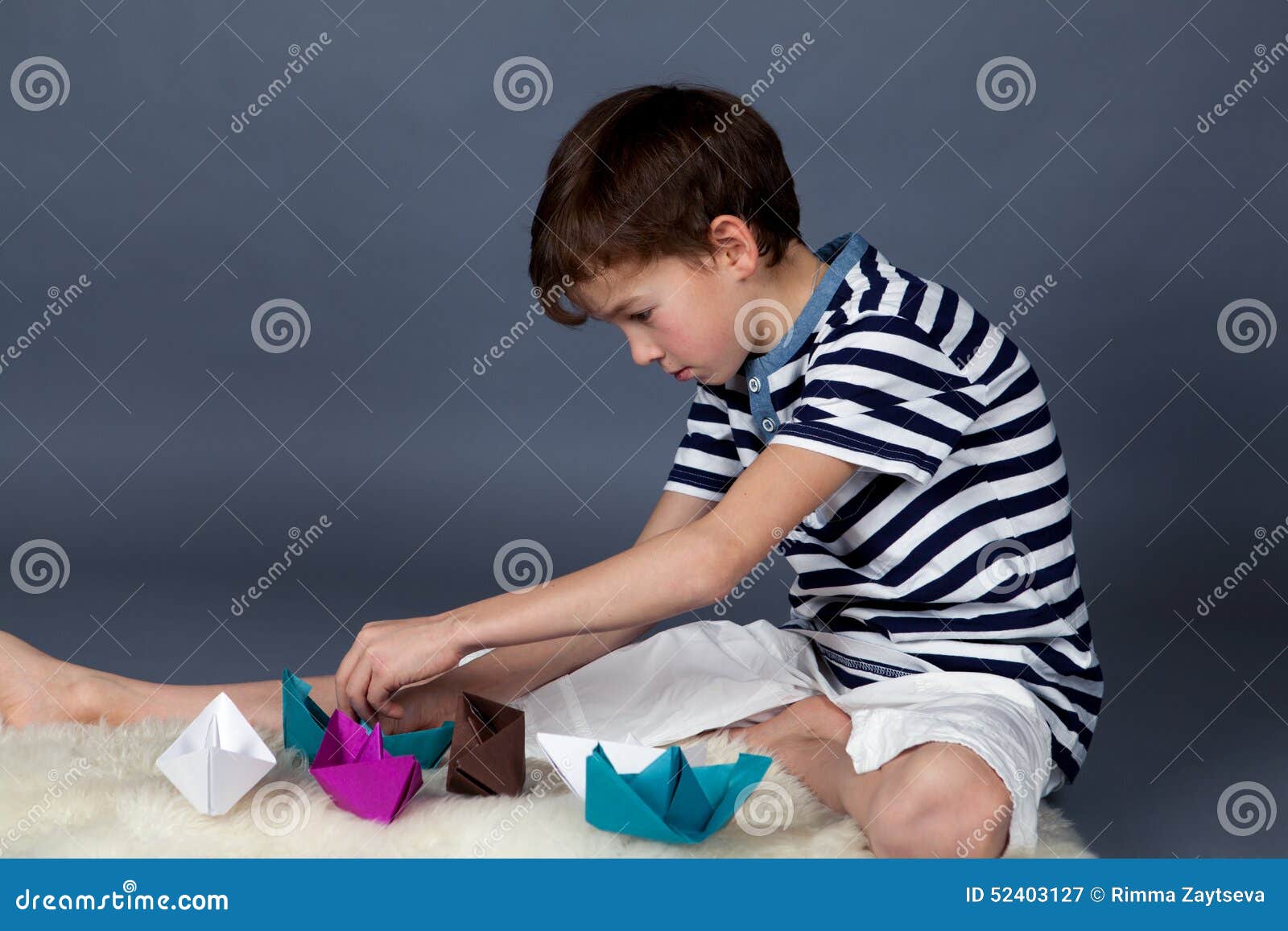 Boy Playing with Paper Boats Stock Image - Image of gray, childhood ...