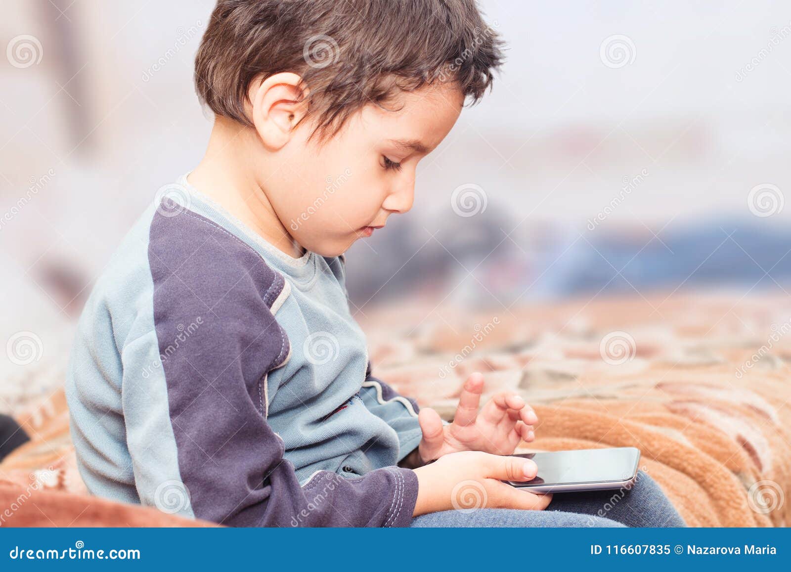 Boy Playing In The Phone Stock Image | CartoonDealer.com #116607835