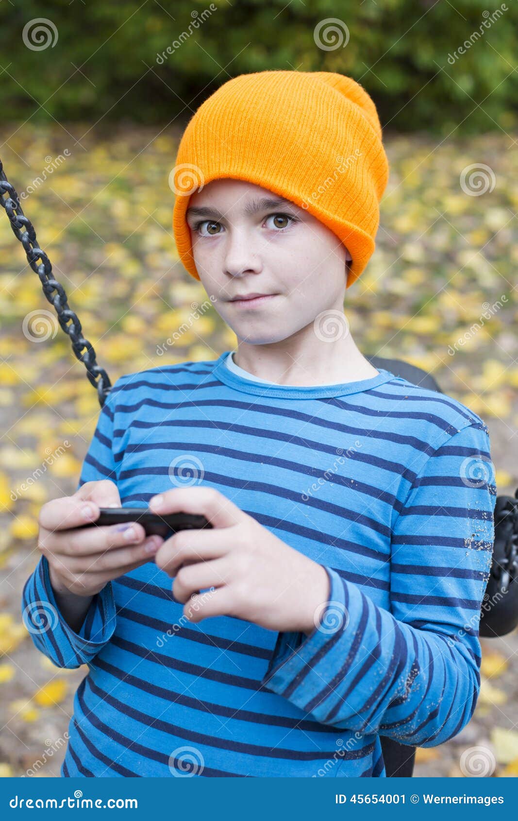 Boy playing on phone stock image. Image of video, phone - 45654001