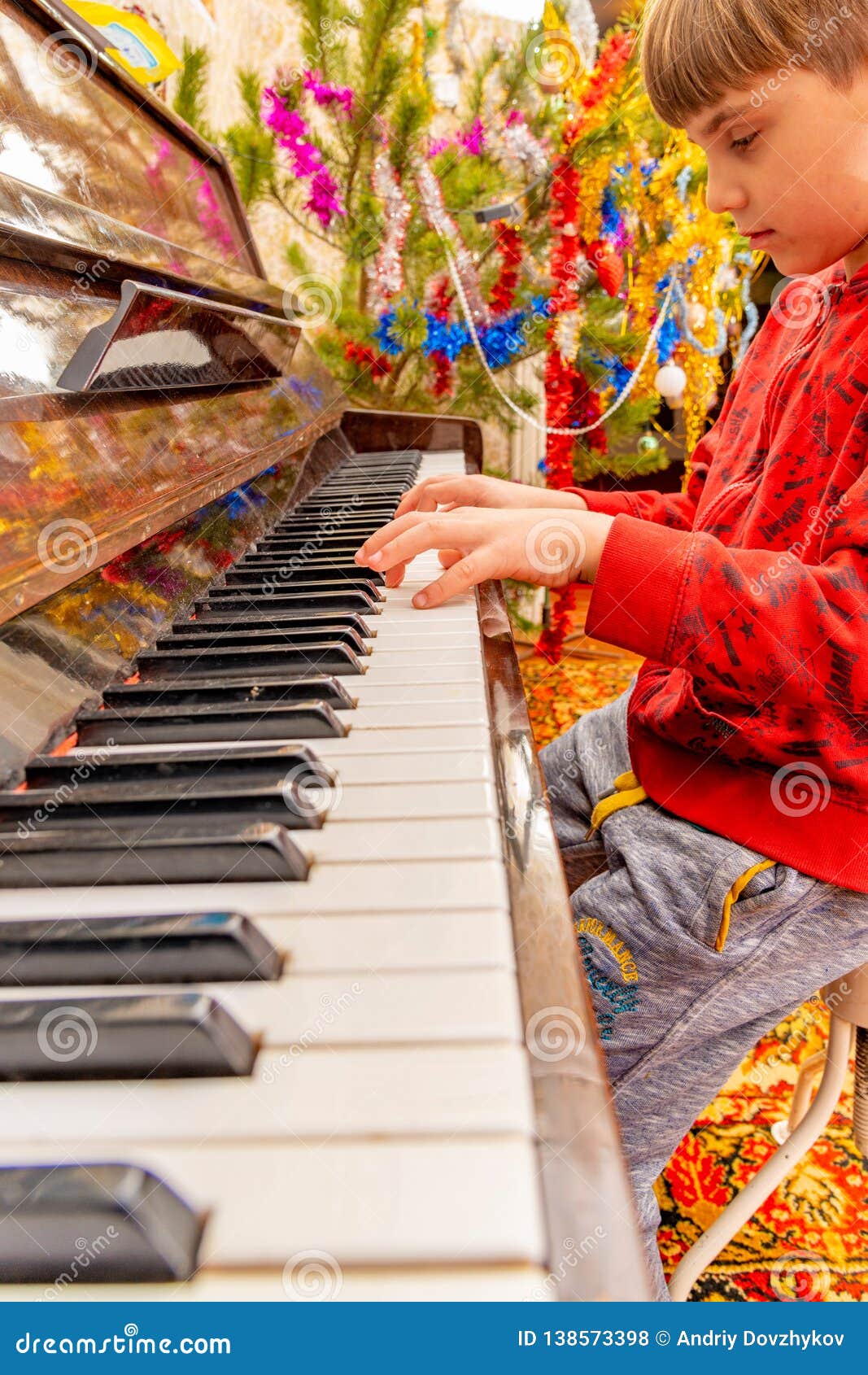 Boy playing piano stock photo. Image of hands, teach - 138573398