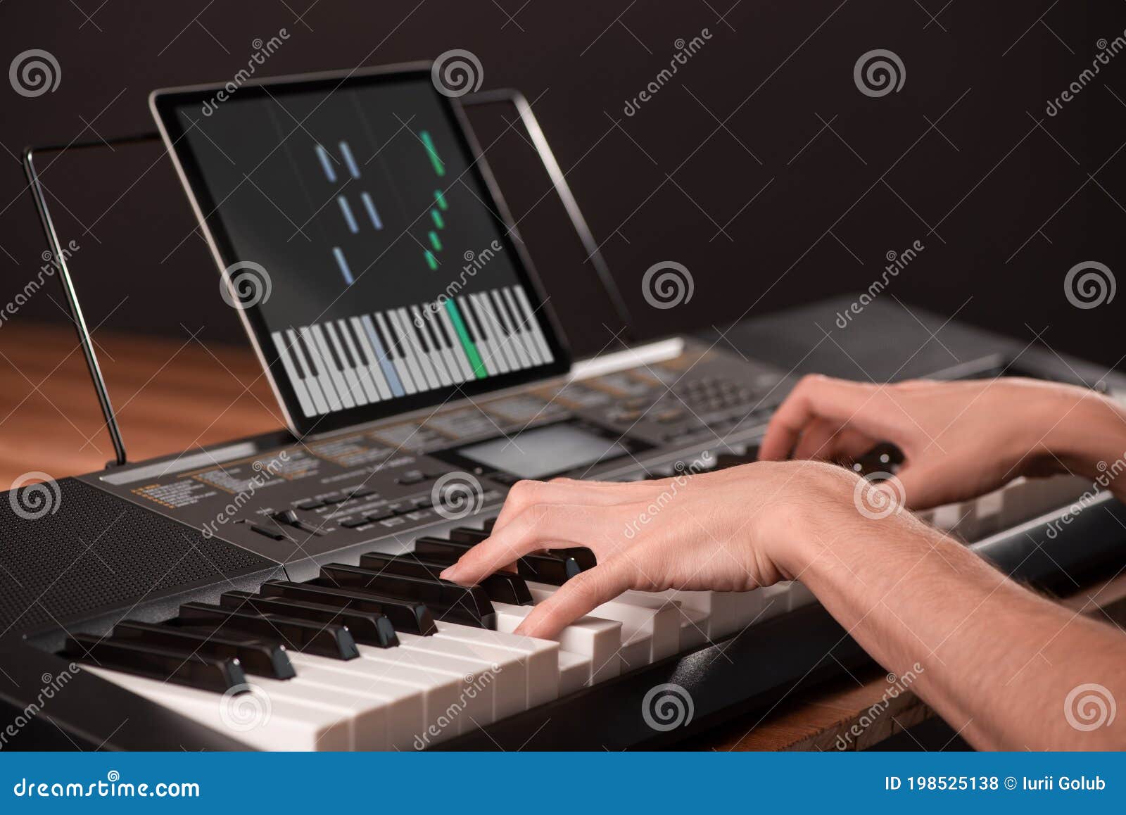 Boy Playing Piano and Using a Learning App on His Tablet Stock Photo ...