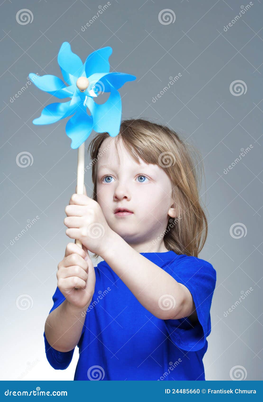 Boy playing with pinwheel stock photo. Image of blue - 24485660
