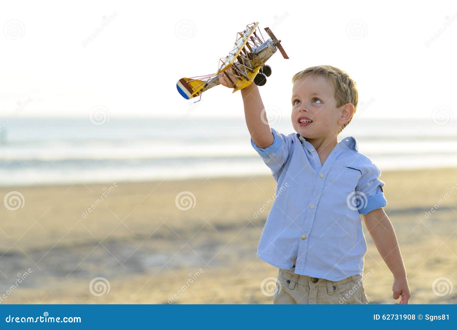 Boy playing with plane stock photo. Image of kids, hobbies - 62731908