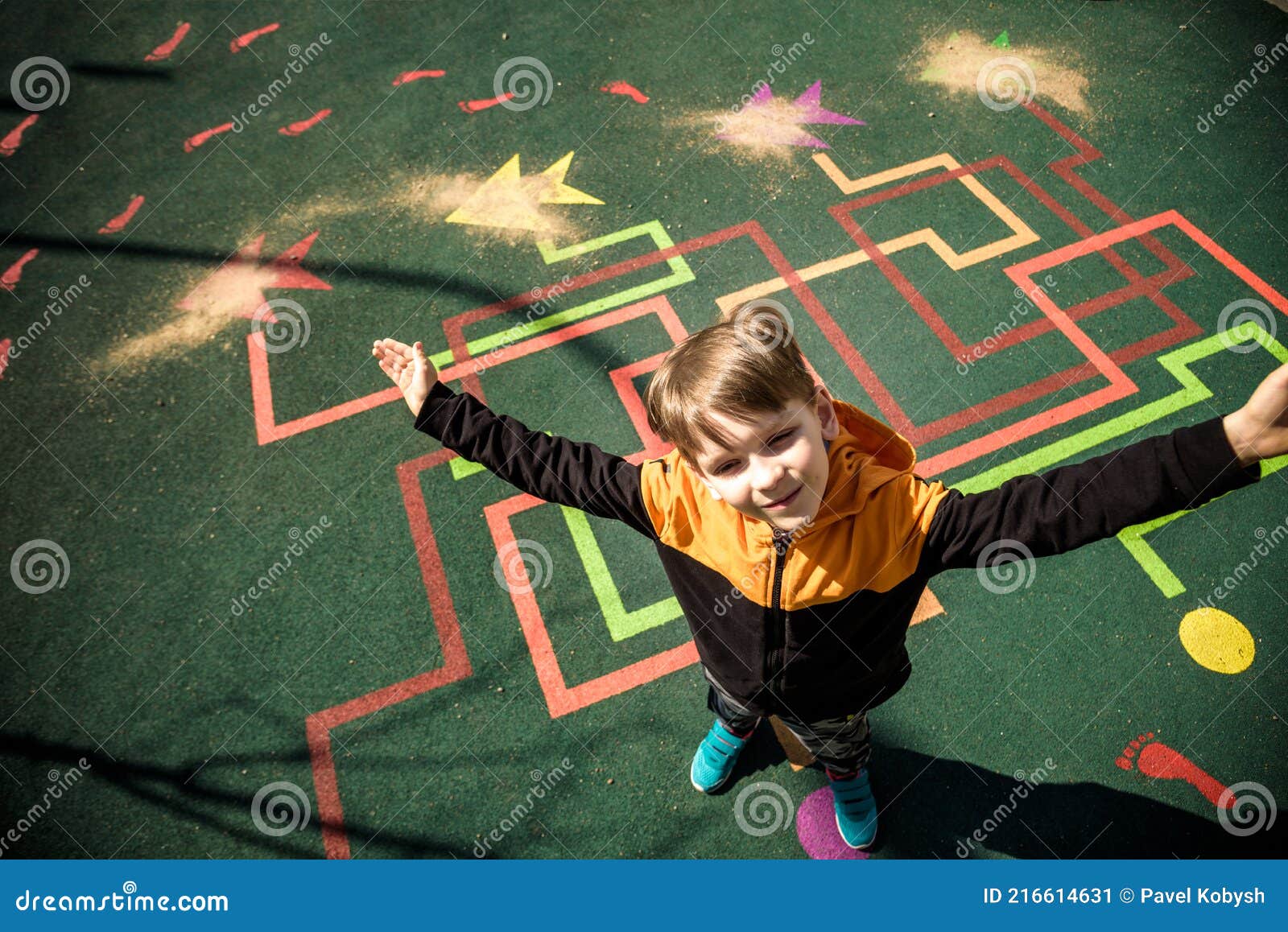 Boy Playing on the Playground, in the Children`s Maze. Children`s Slide ...