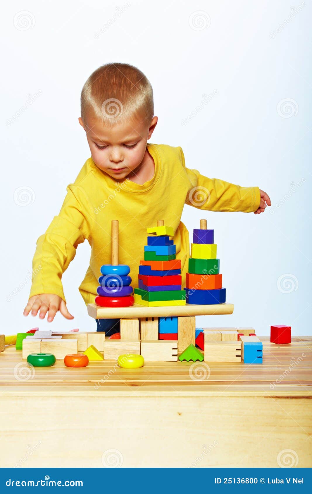 Boy playing with pyramid stock photo. Image of background - 25136800
