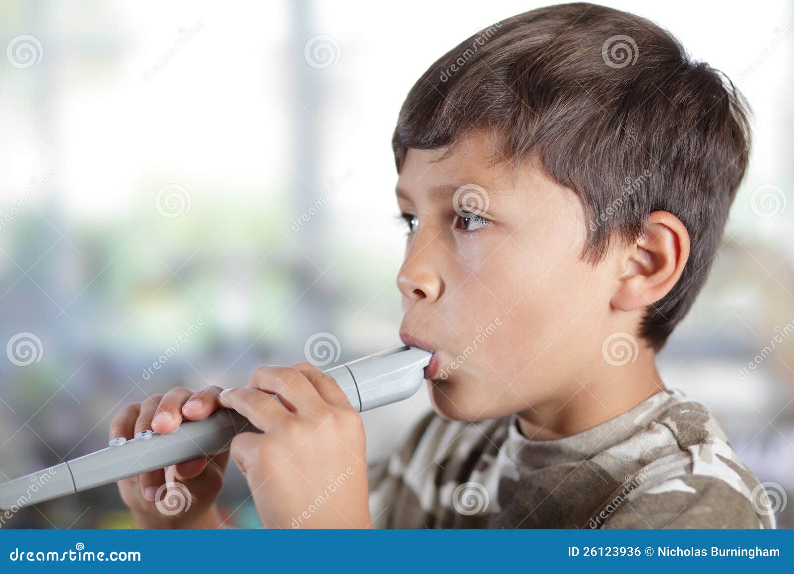 Boy playing recorder stock photo. Image of joyful, blowing - 26123936