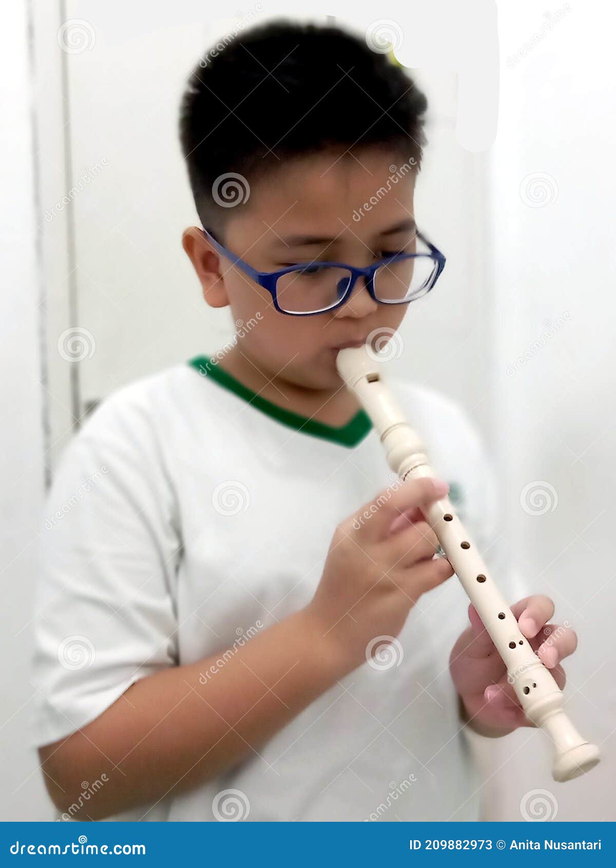 A Boy is Playing the Recorder Stock Image - Image of hairstyle ...