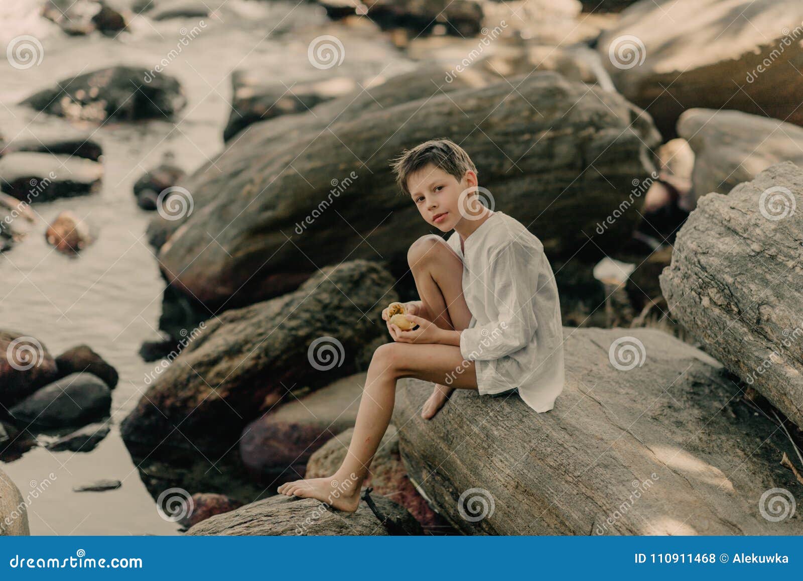The Boy is Playing on Rocks Stock Photo - Image of ocean, lifestyle ...