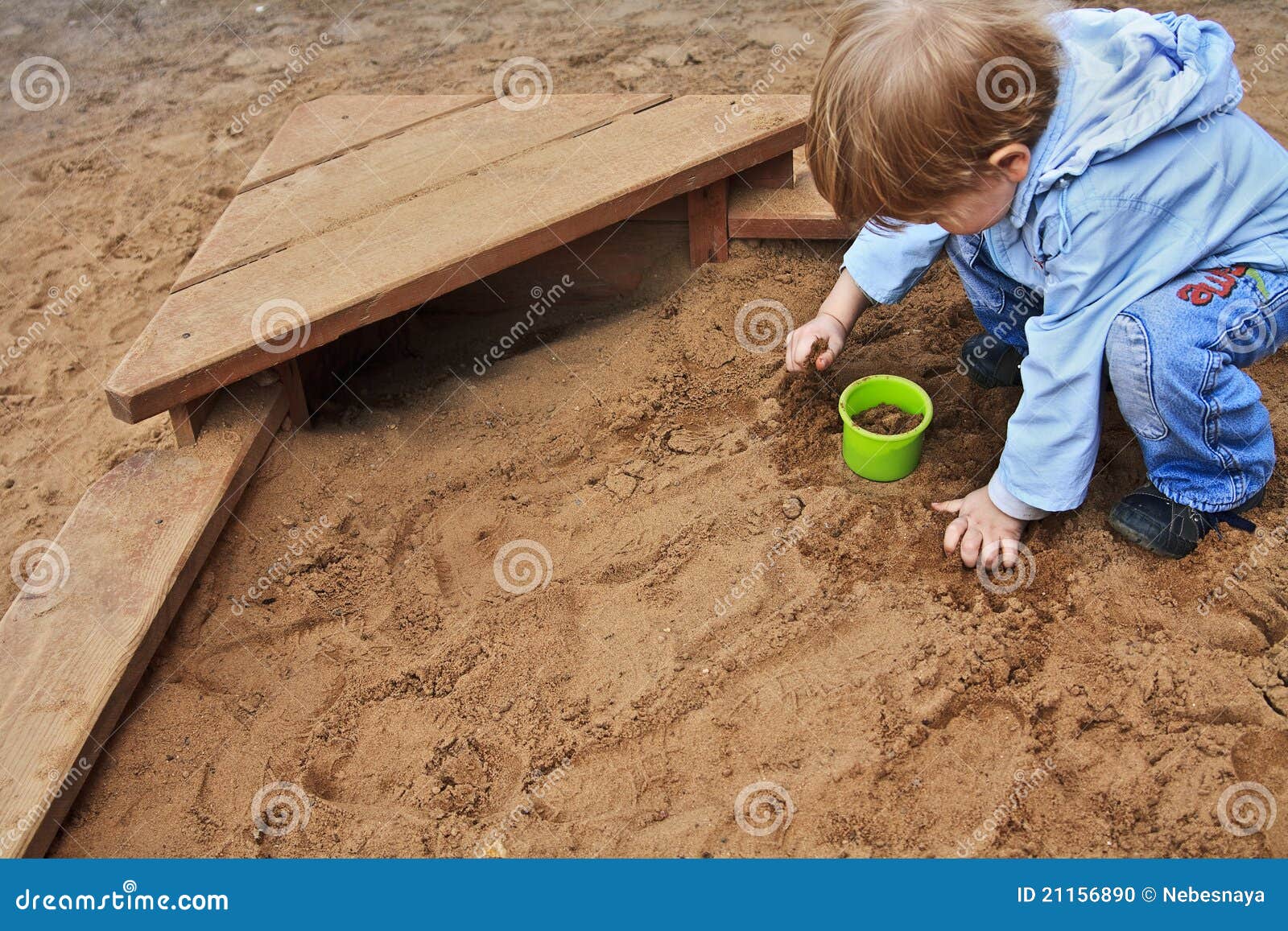 Boy playing with sand stock photo. Image of lonely, playful - 21156890