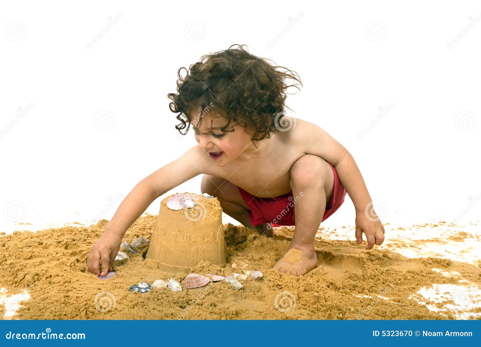 Boy playing in the sand stock photo. Image of child, isolated - 5323670