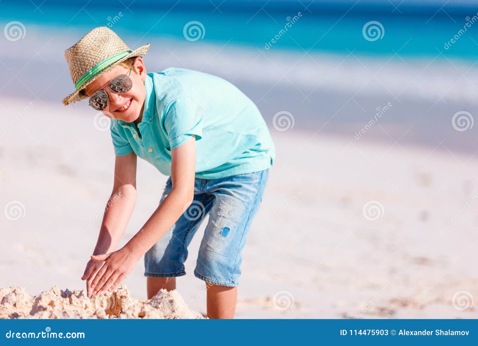 Boy playing with sand stock image. Image of childhood - 114475903