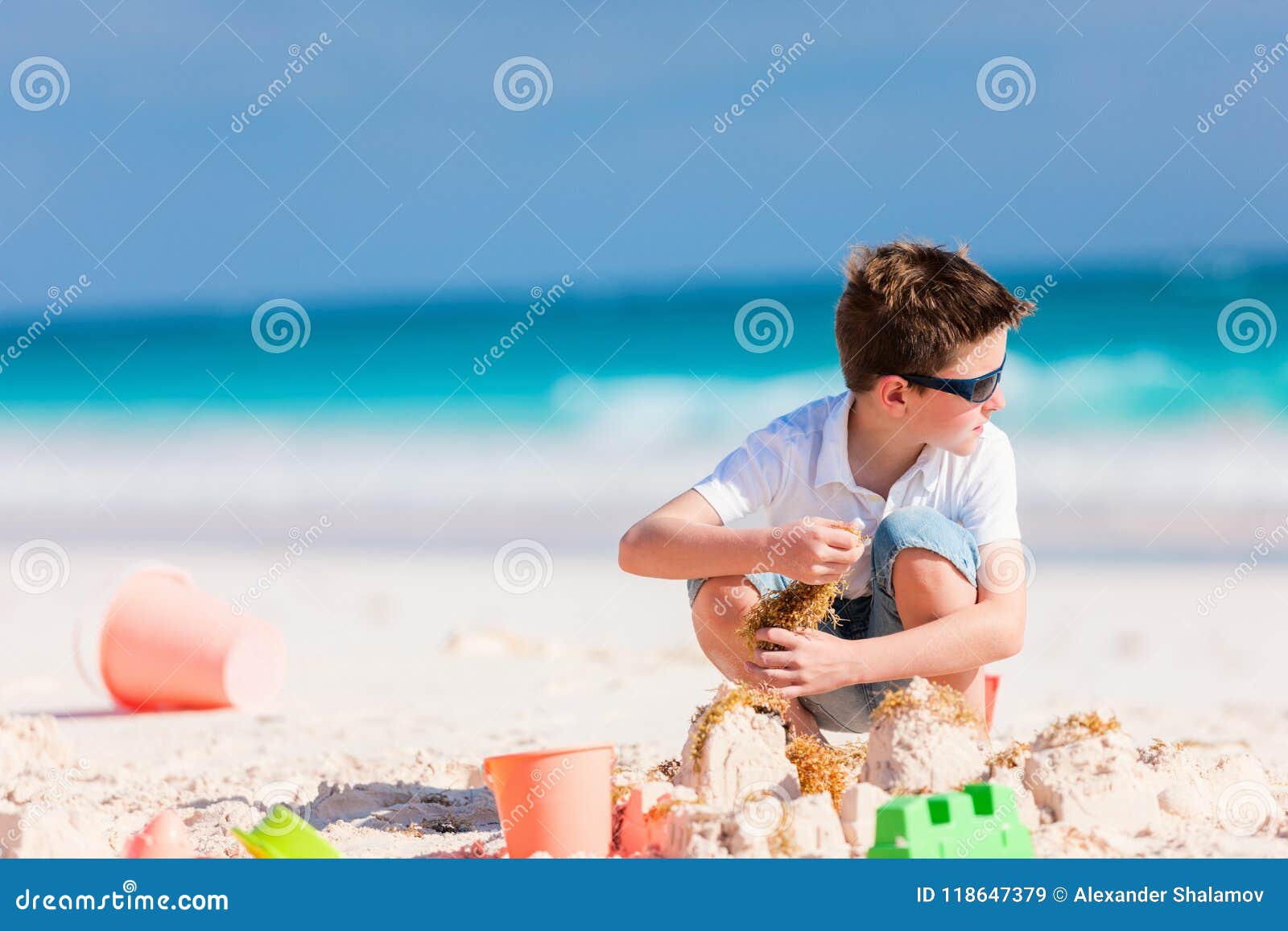Boy playing with sand stock image. Image of youth, authentic - 118647379