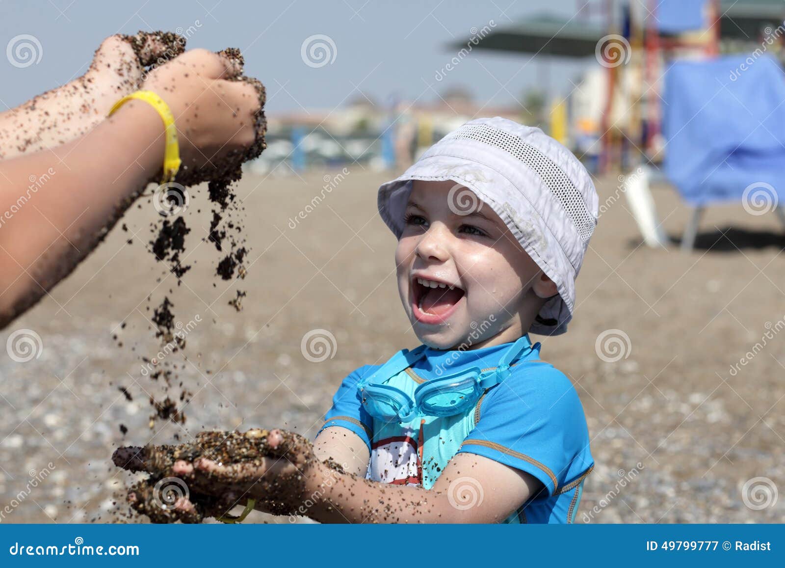 Boy playing with sand stock image. Image of resort, lifestyle - 49799777