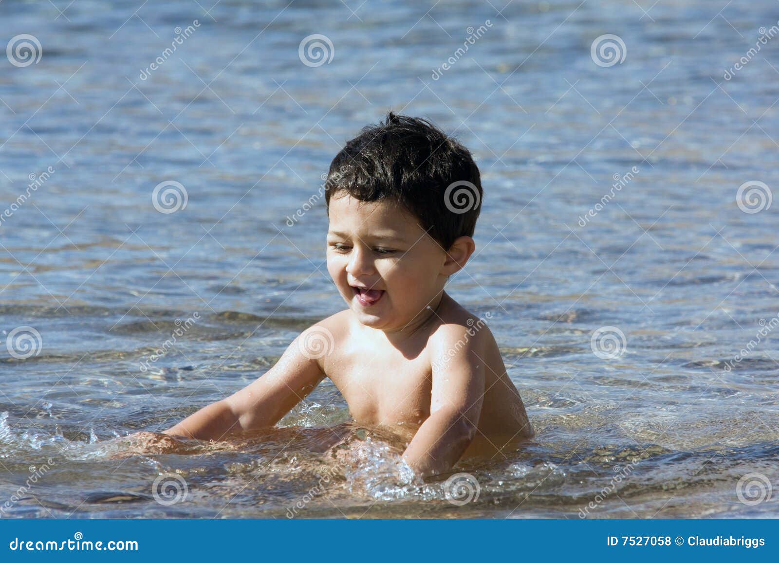 Boy playing in the sea stock photo. Image of happiness - 7527058