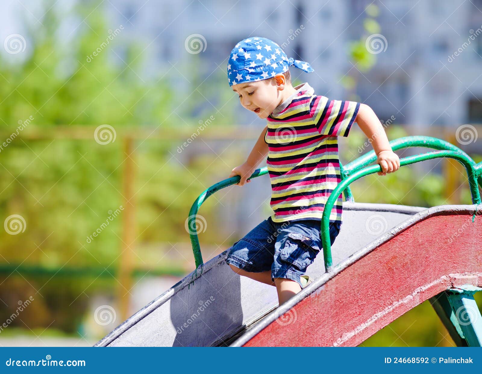 Boy playing on slide stock photo. Image of urban, enjoyment - 24668592