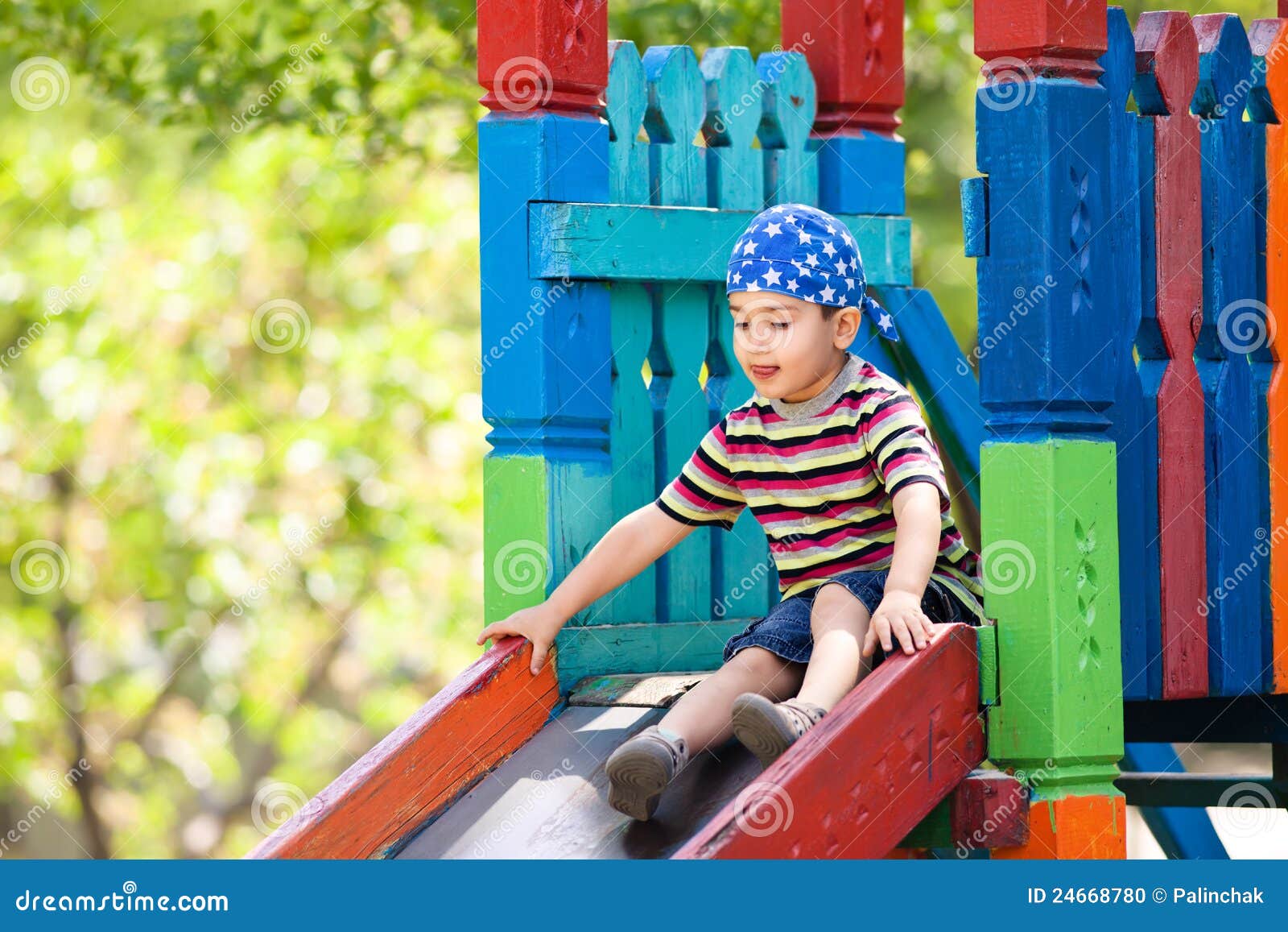 Boy playing on slide stock photo. Image of child, slide - 24668780