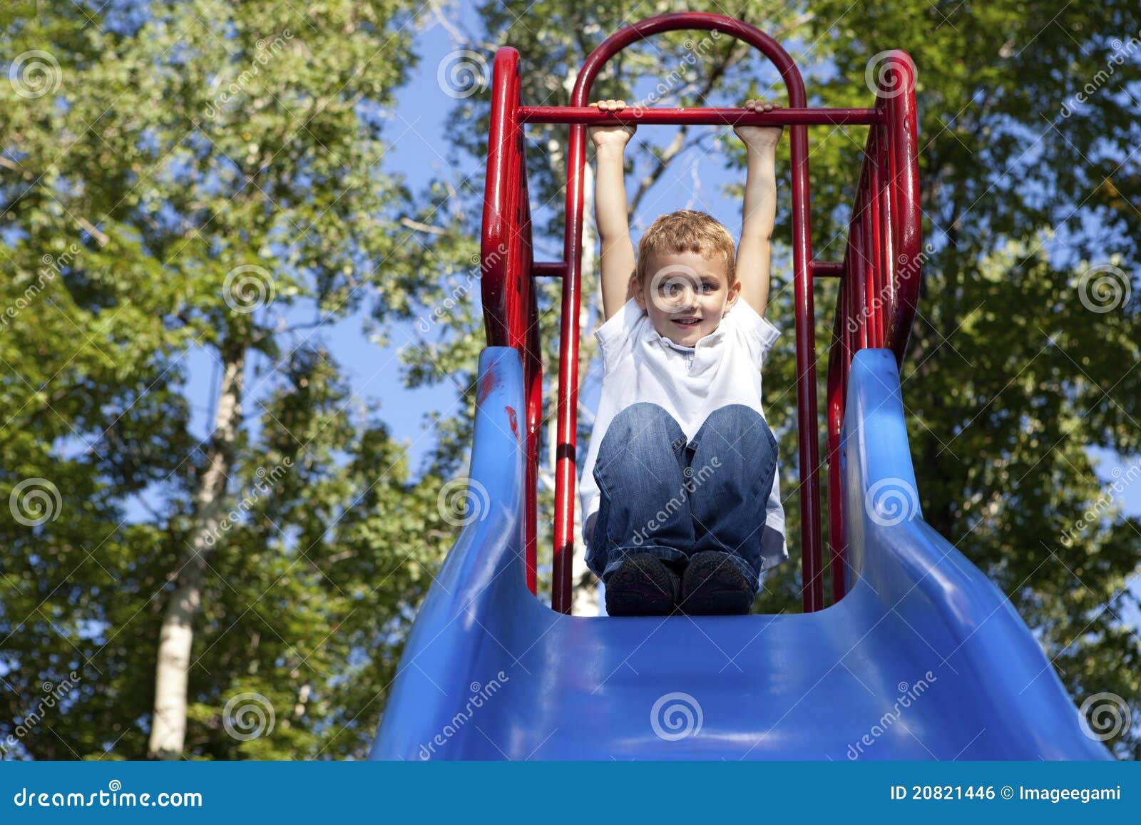 Boy Playing on a Slide at the Park Stock Photo - Image of enjoying ...